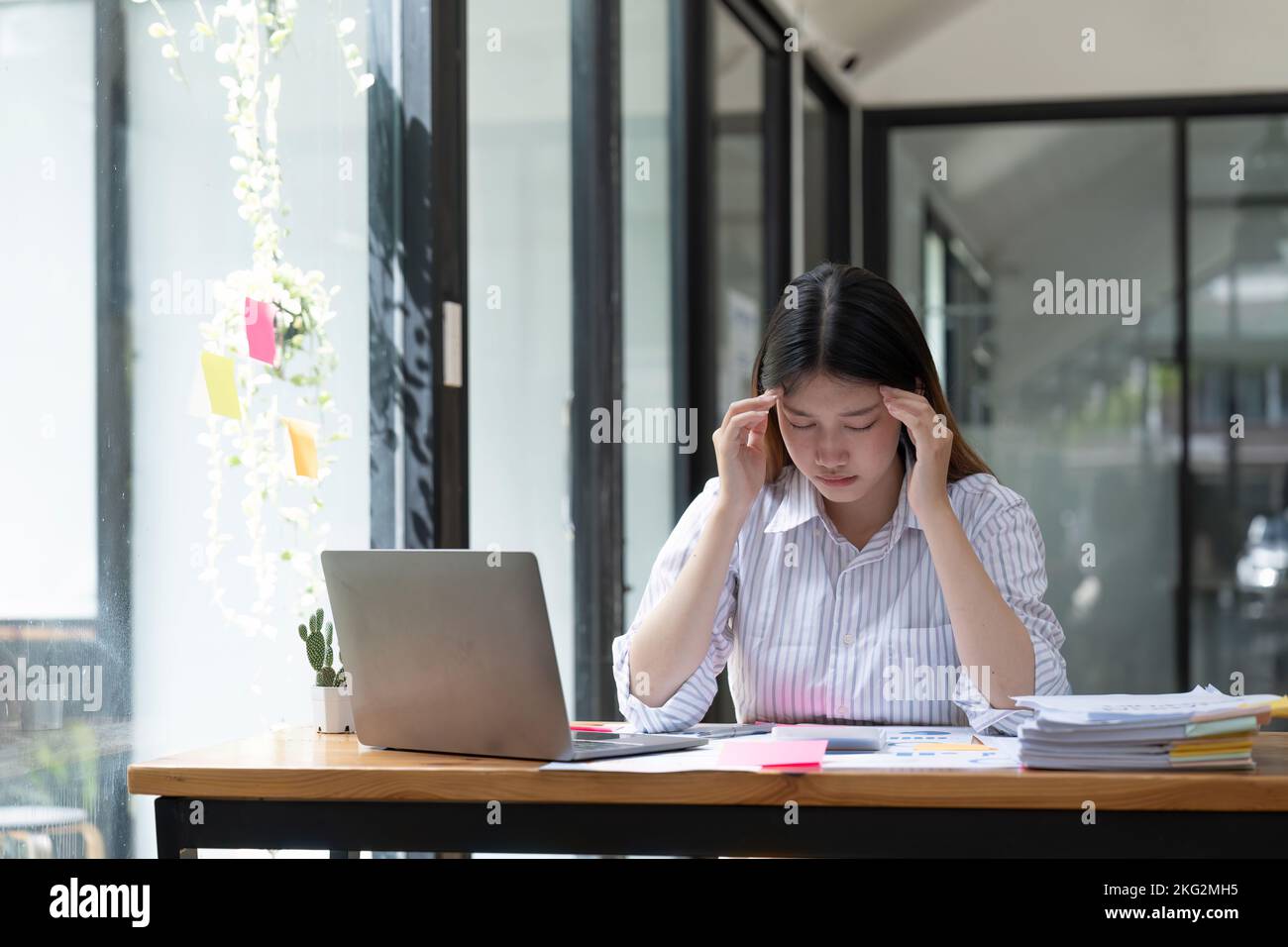 Tired asian business woman with headache at office, feeling sick ...
