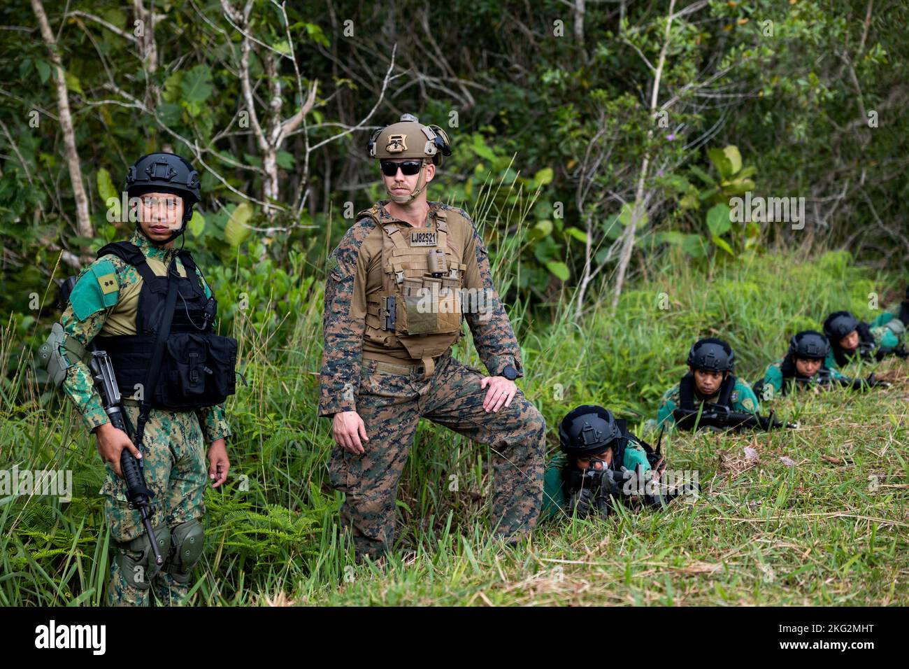 U.S. Marine Corps Capt. Luke Jackson, second from left, an ...