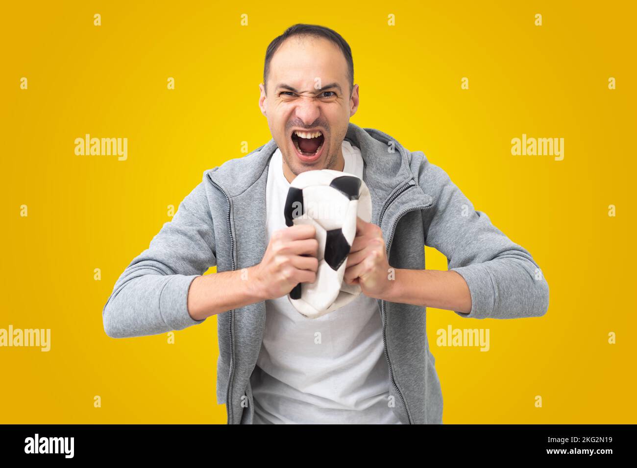 football fan with a deformed ball Stock Photo - Alamy