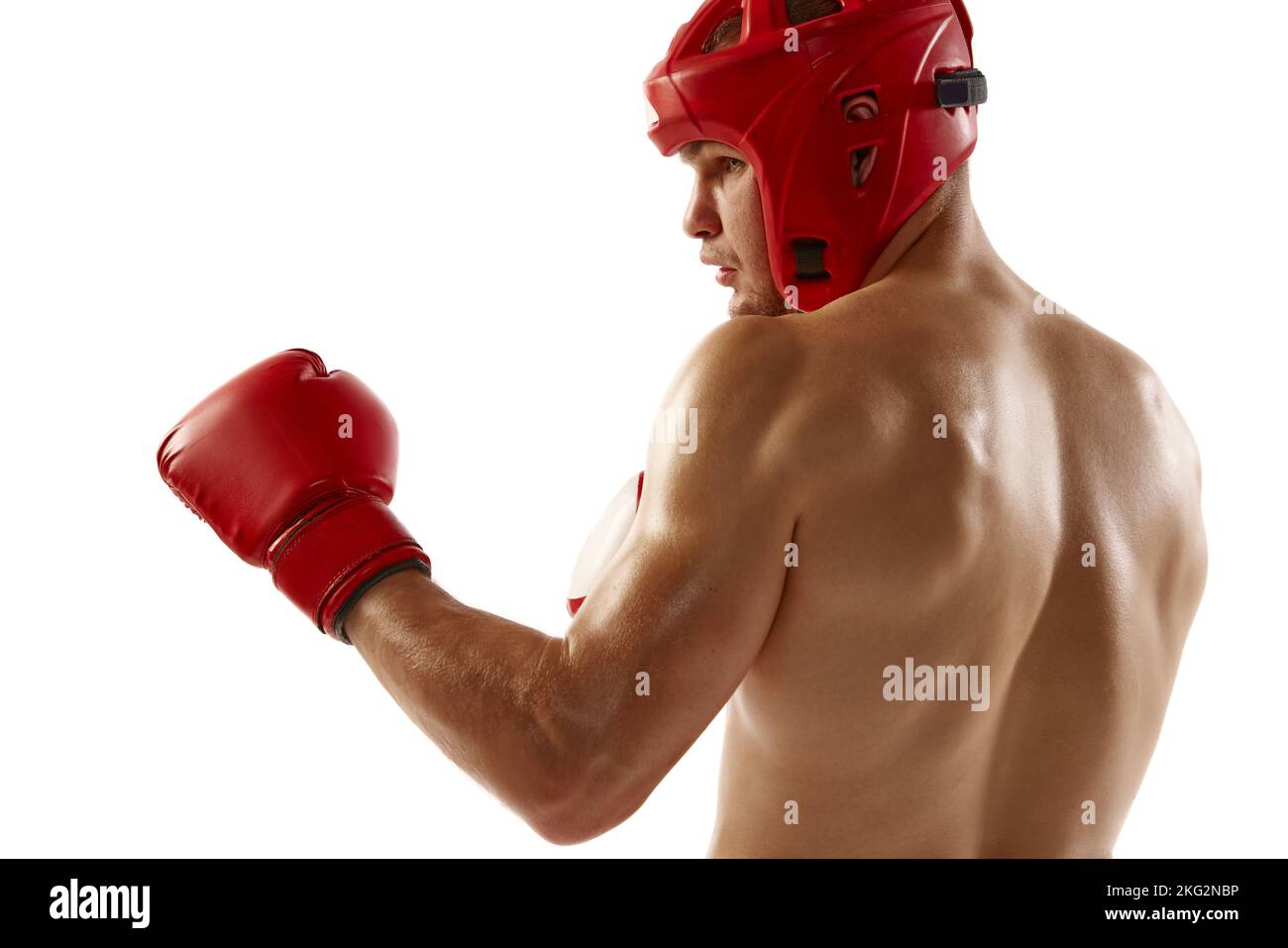 Punch. Young muscled athlete, professional kickboxer in protective ...