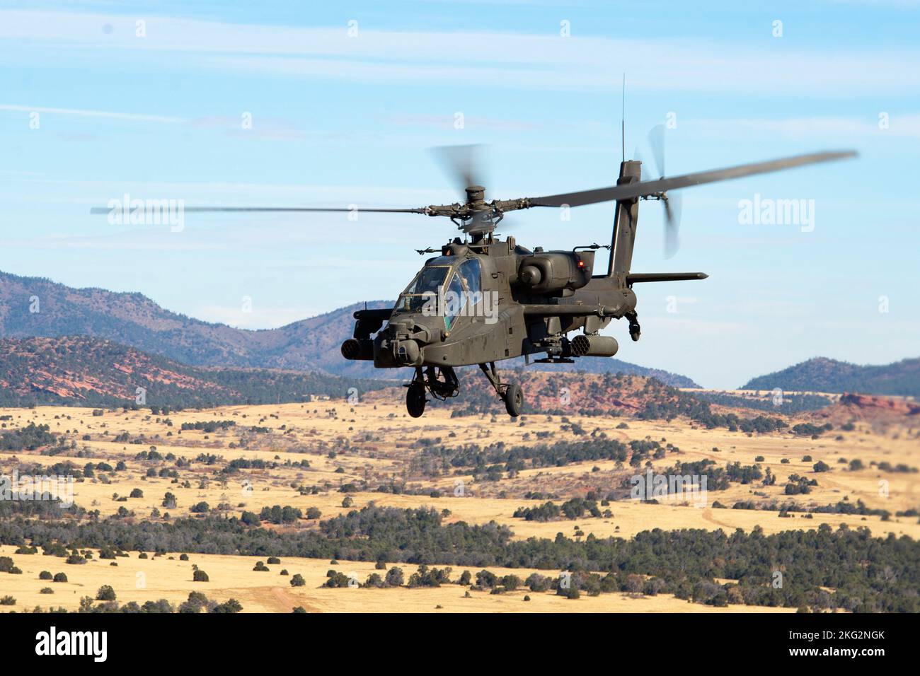 An Apache helicopter follows a 93rd Joint Civilian Orientation ...