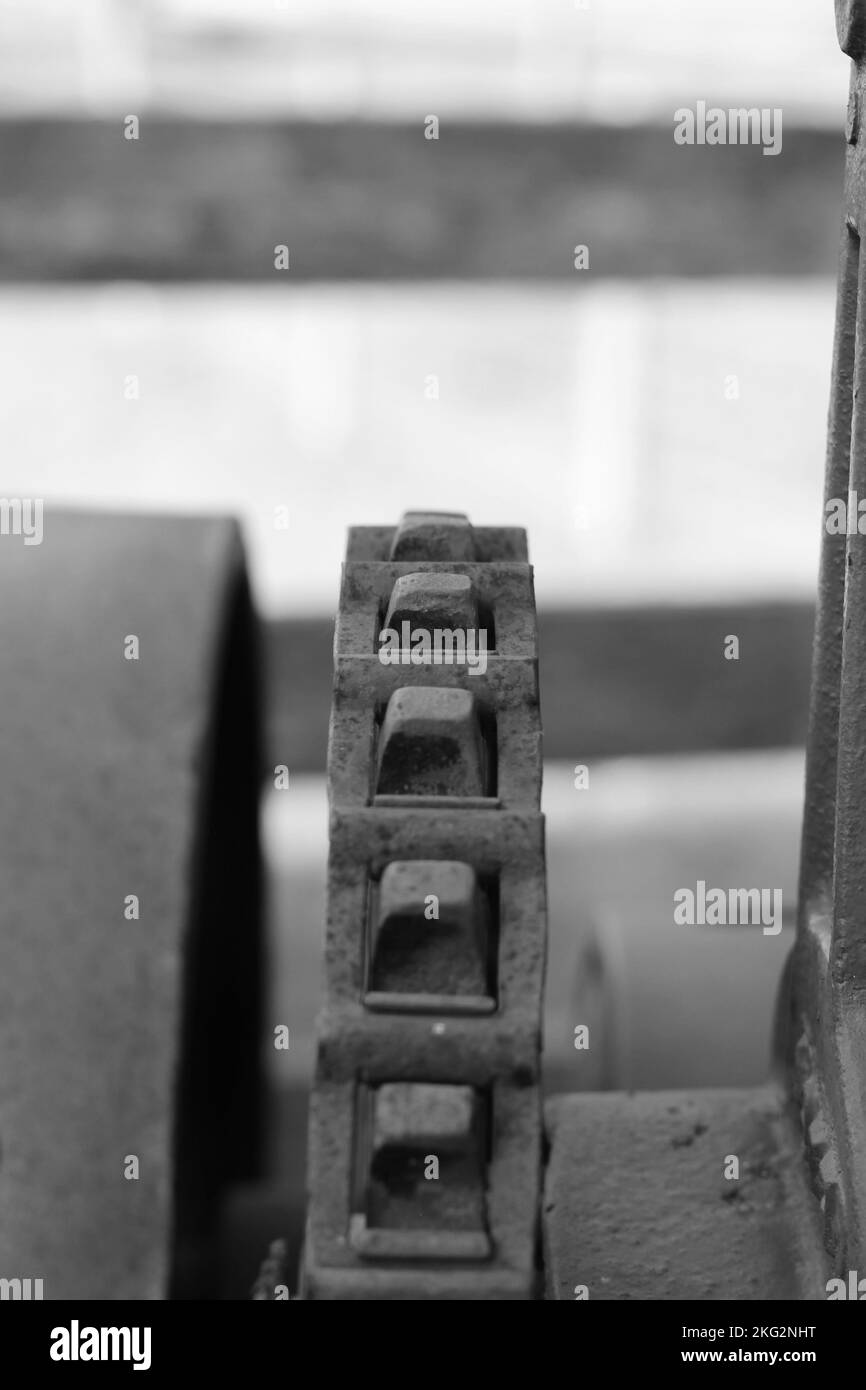 Vintage mechanical machine and engine with chains and gears in a black ...