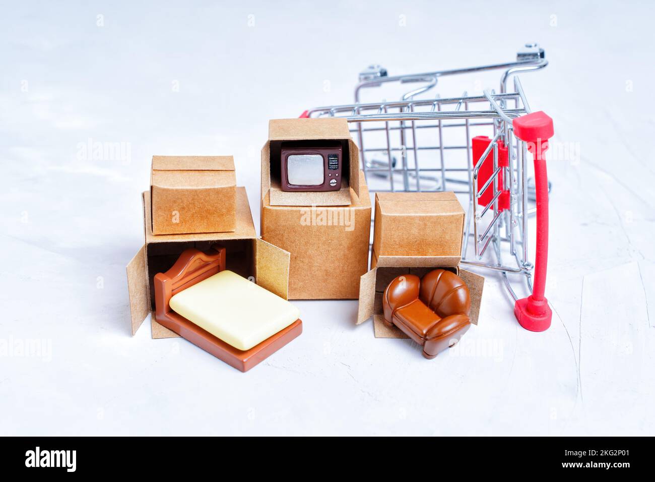 Unpacked tiny delivery boxes with miniature furniture figurines by a ...