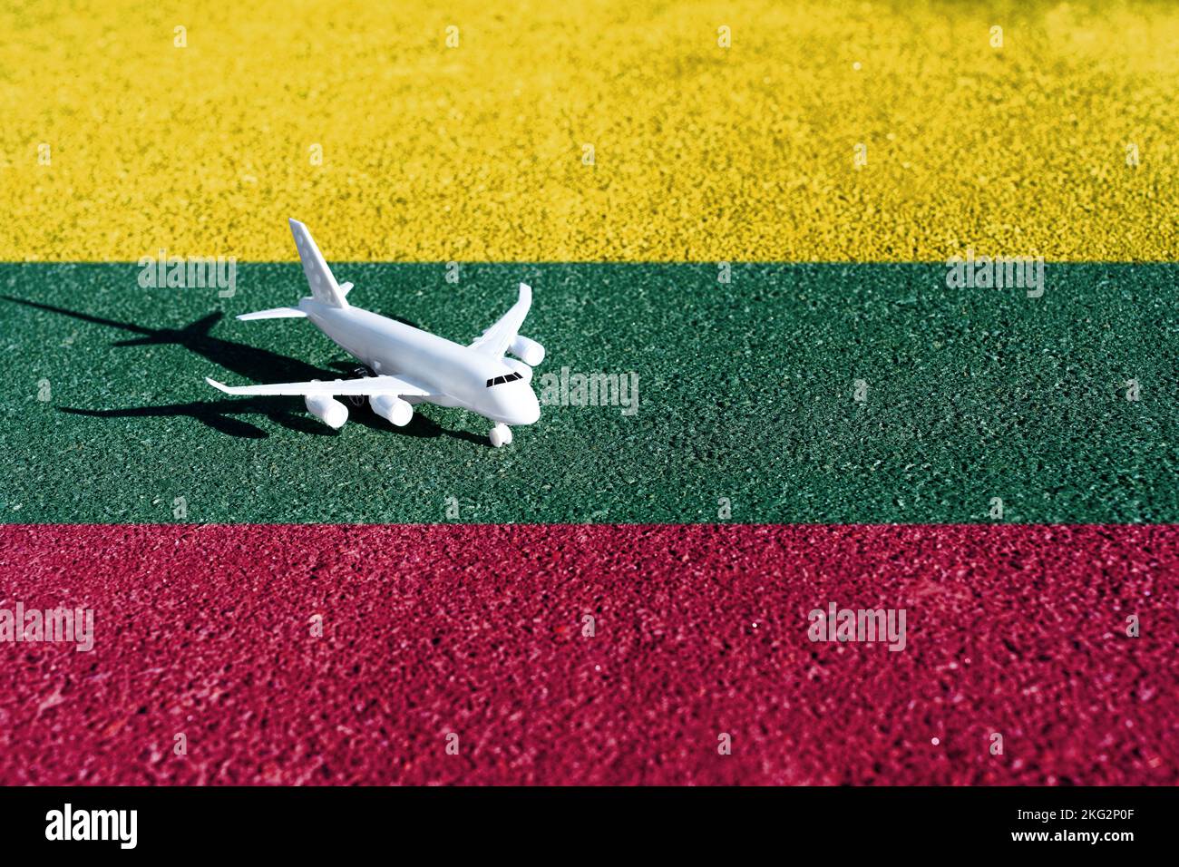 Toy airplane placed on the road painted the colors of the national flag ...