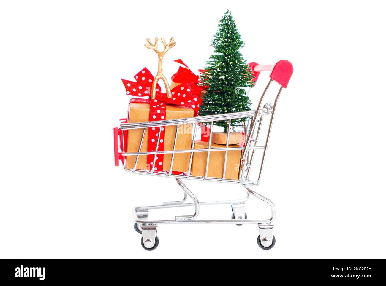 Toy christmas props and wrapped gift boxes in a miniature shopping ...