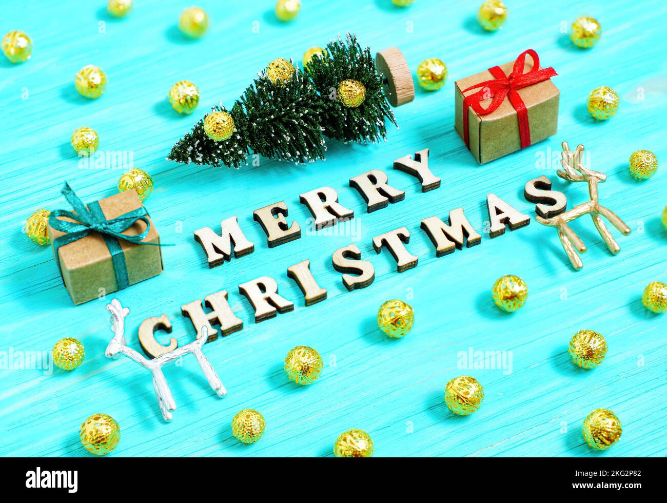 Happy Holidays lettering arranged from wooden letters and framed with ...