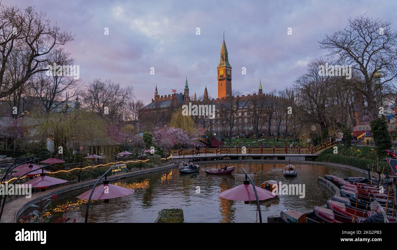 The beautiful Tivoli amusement park at sunset in Copenhagen, Denmark ...