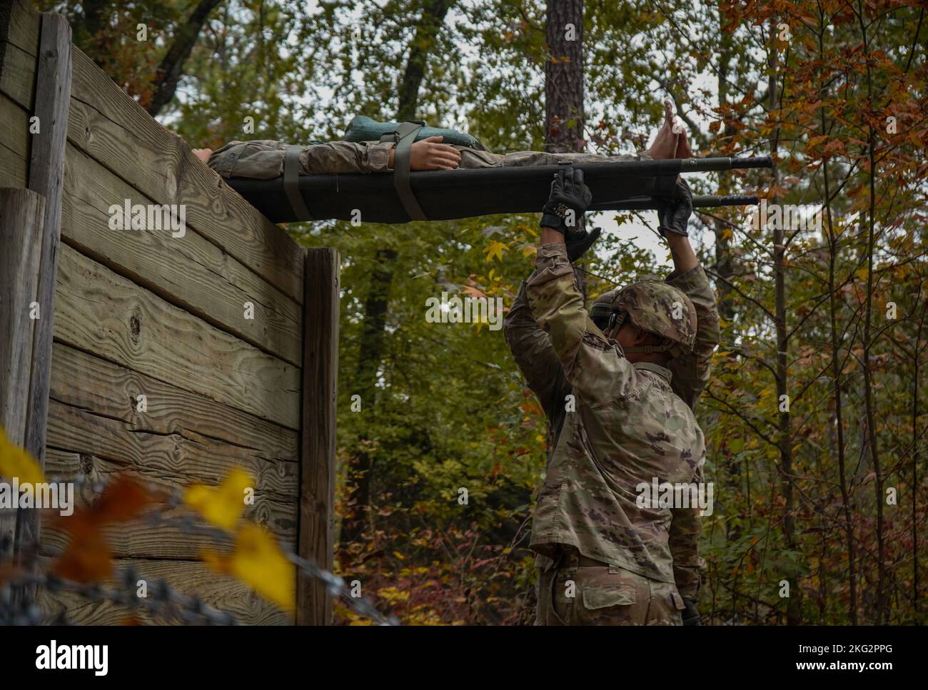 Competitors assigned to the 20th Engineer Brigade lift a simulated ...