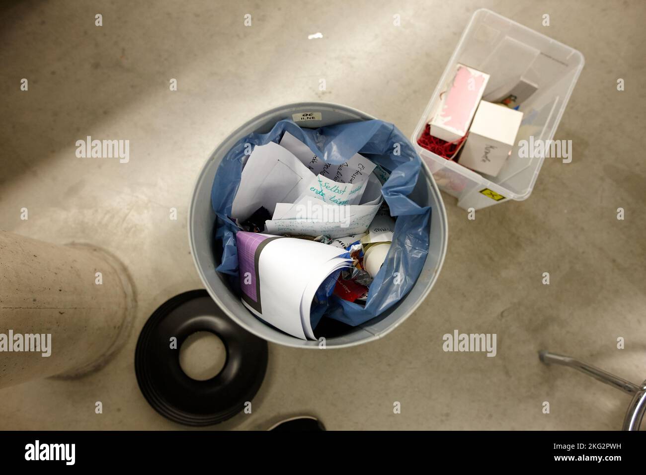 A top view of a trash can full of paper Stock Photo - Alamy