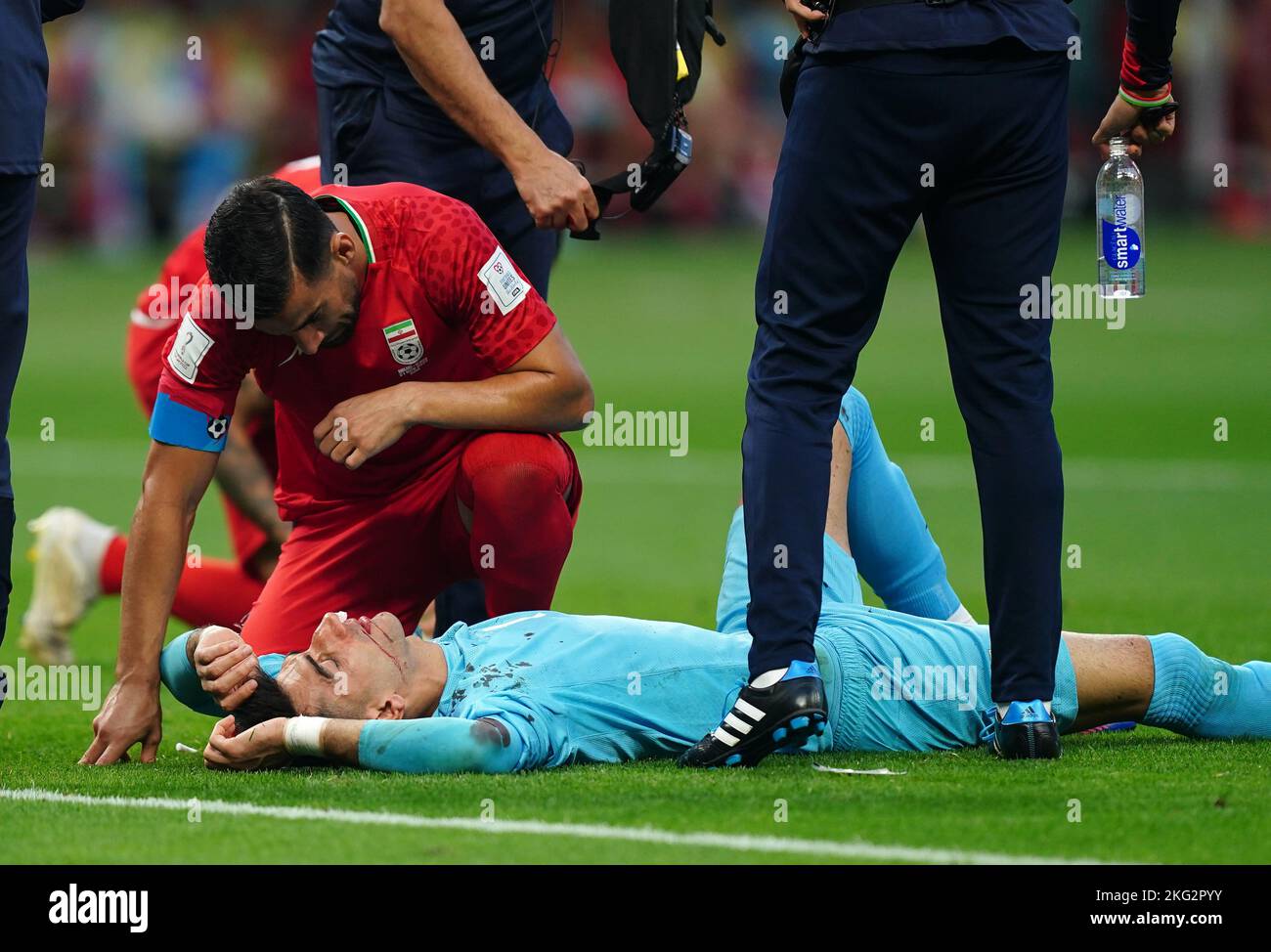 Iran goalkeeper Alireza Beiranvand receives treatment for an injury ...