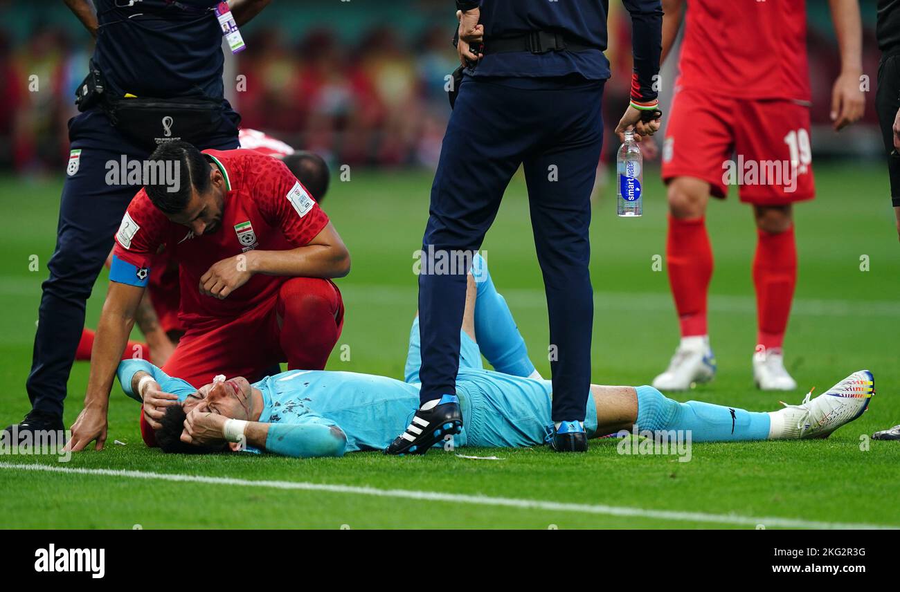 Iran goalkeeper Alireza Beiranvand receives treatment for an injury ...