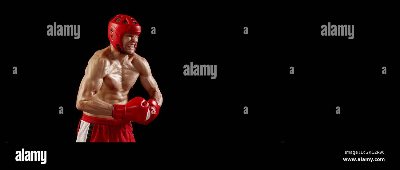 Studio shot of male kickboxer, mma fighter in motion and action ...