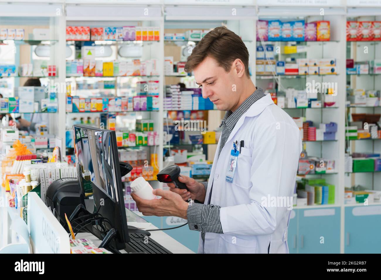 Pharmacist scanning medication scanner hi-res stock photography and ...