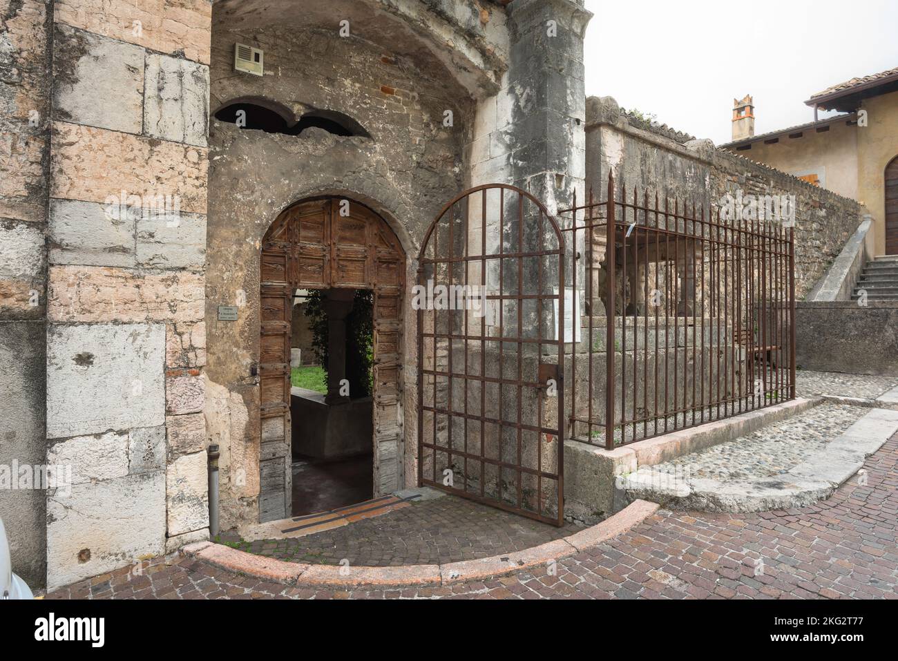 Monastery Gargnano, view of the Romanesque entrance to the historic San ...