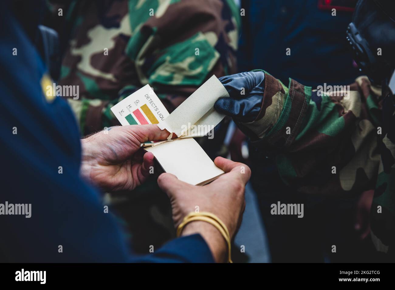 Damage Controlman Chief Jordan Belcher, left, assigned to the Arleigh ...