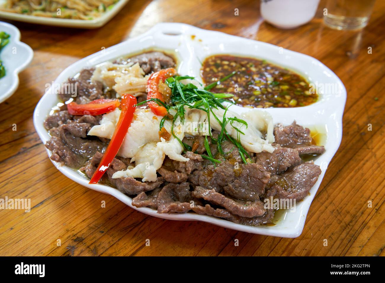 A delicious Chinese dish, boiled beef and sirloin on film Stock Photo ...