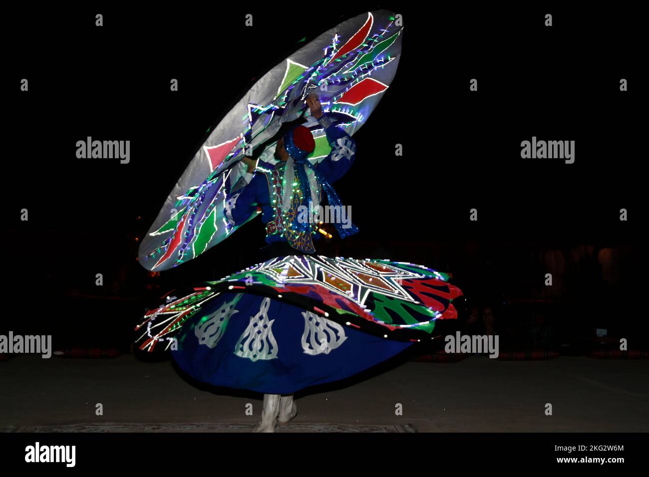 Tanoura Dance performed at night in a desert camp for tourists. United ...