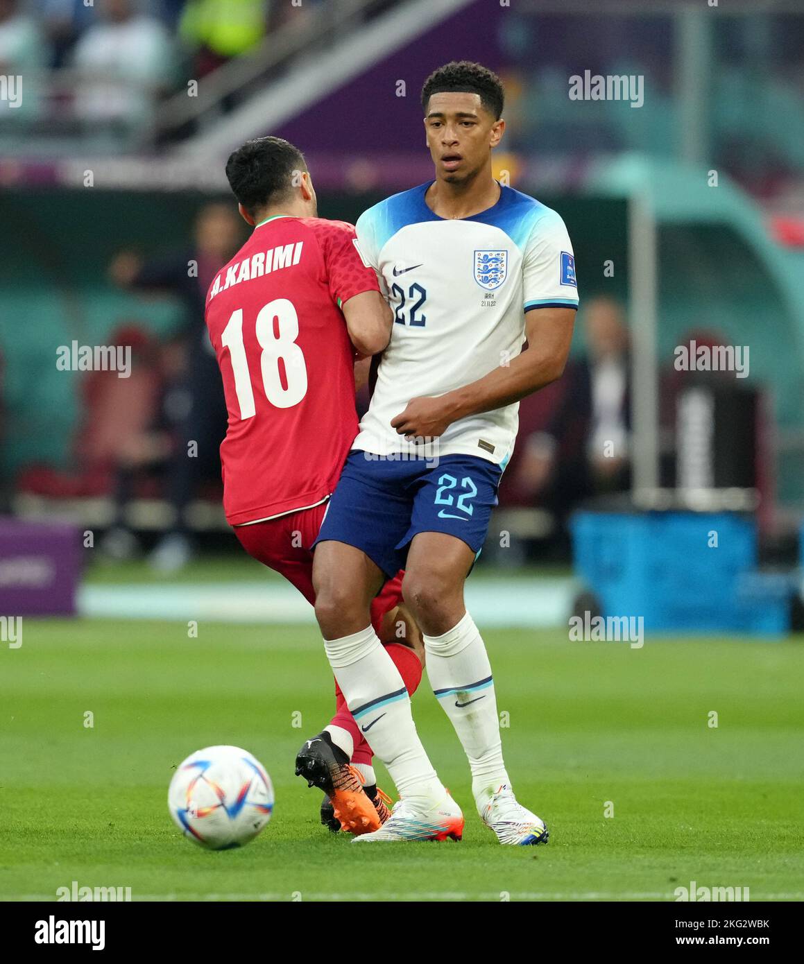 England's Jude Bellingham is tackled by Iran's Ali Karimi during the ...