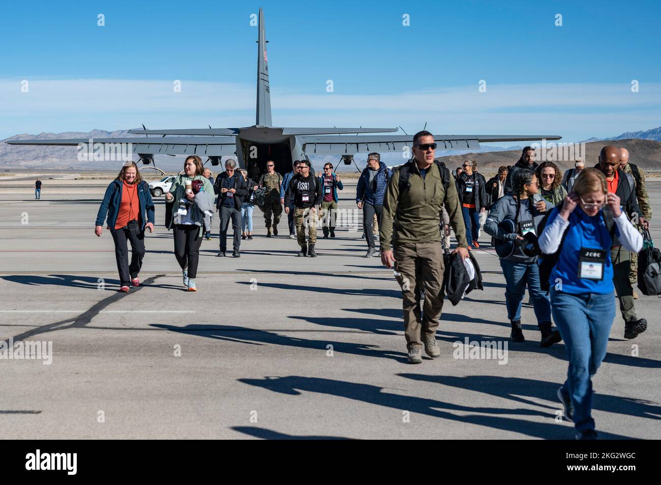 Members of the Joint Civilian Orientation Conference exit a C-130J ...