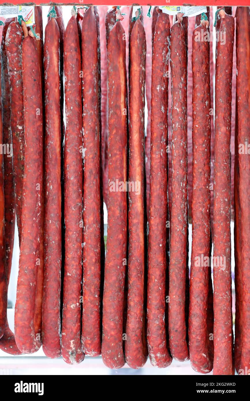 Sausage hang for a butchers display at an indoor Malaga market. Spain ...