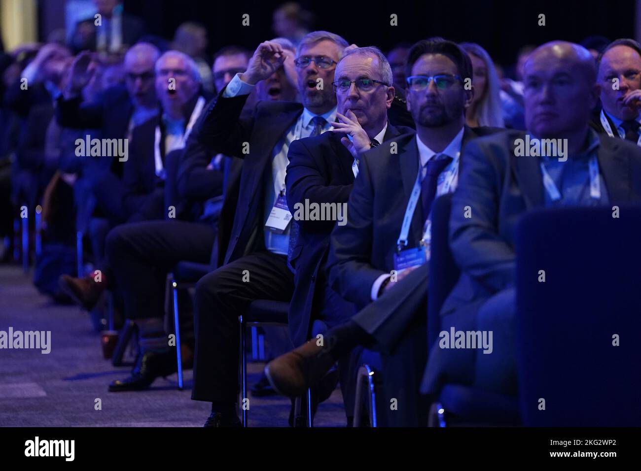 Conference attendees watch the England v Iran FIFA World Cup 2022 game ...