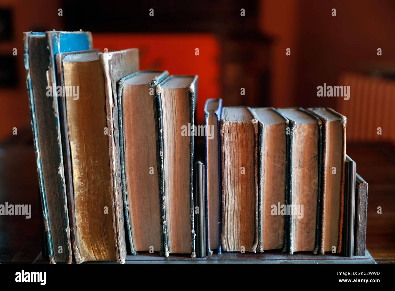 A row of old used books on a table Stock Photo - Alamy