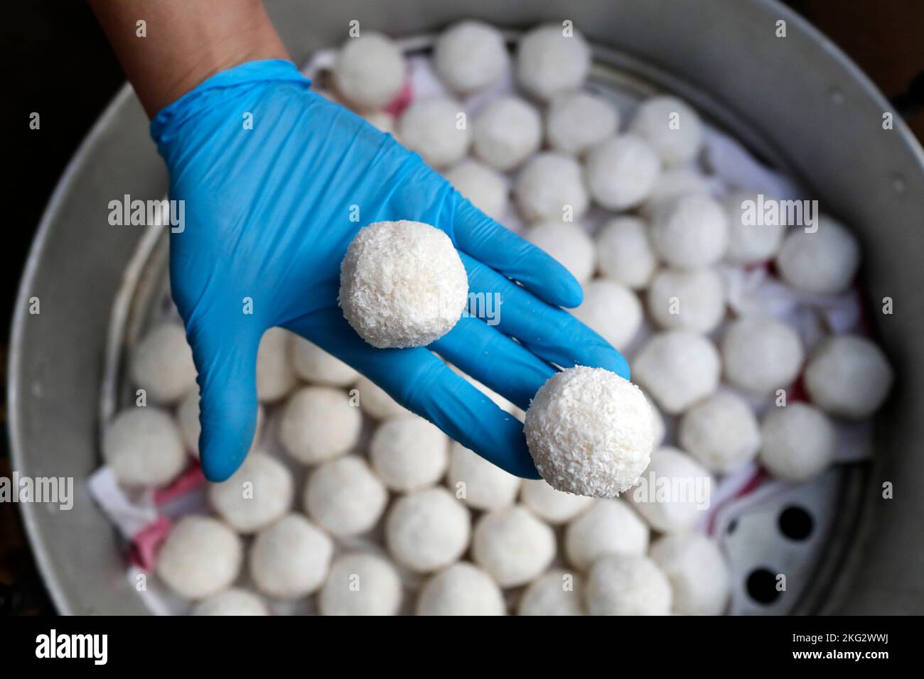 Woman coocking coco balls in a restaurant Stock Photo - Alamy