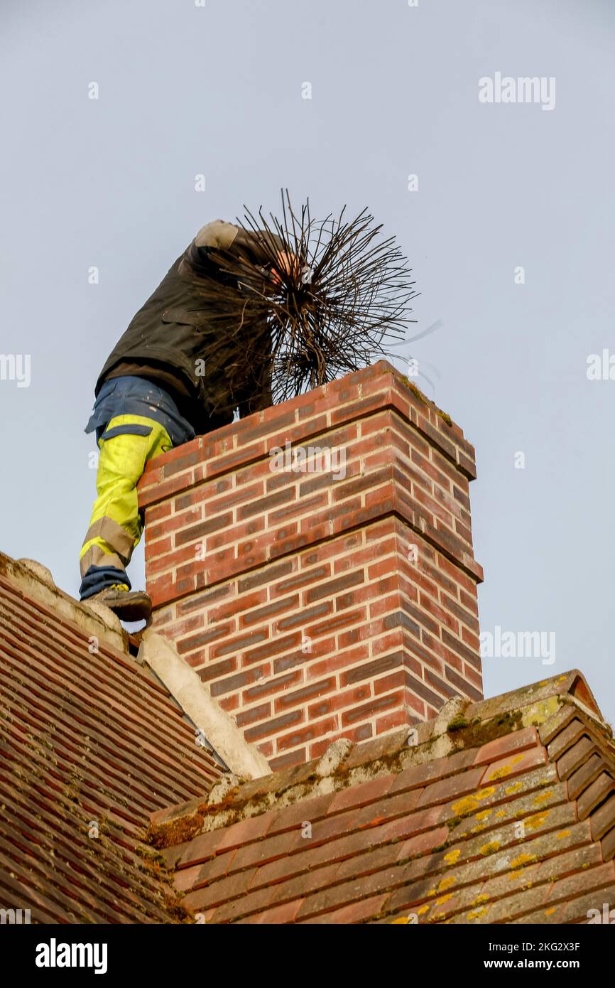 Chimney sweeper at work in Eure, France Stock Photo - Alamy