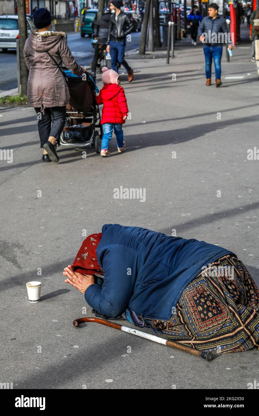 Beggar lying in the street hi-res stock photography and images - Alamy