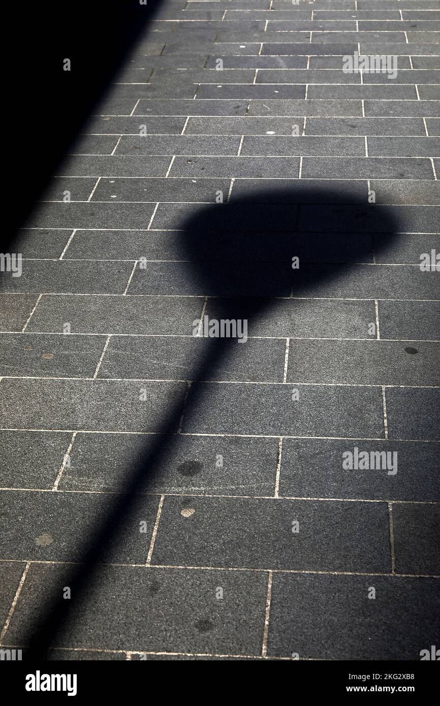 Shadow of a lamp post in Paris, France Stock Photo - Alamy
