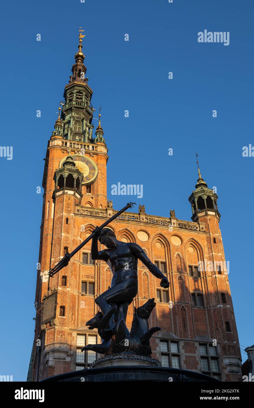 The Neptune Fountain and Main Town Hall building at sunset in city of ...