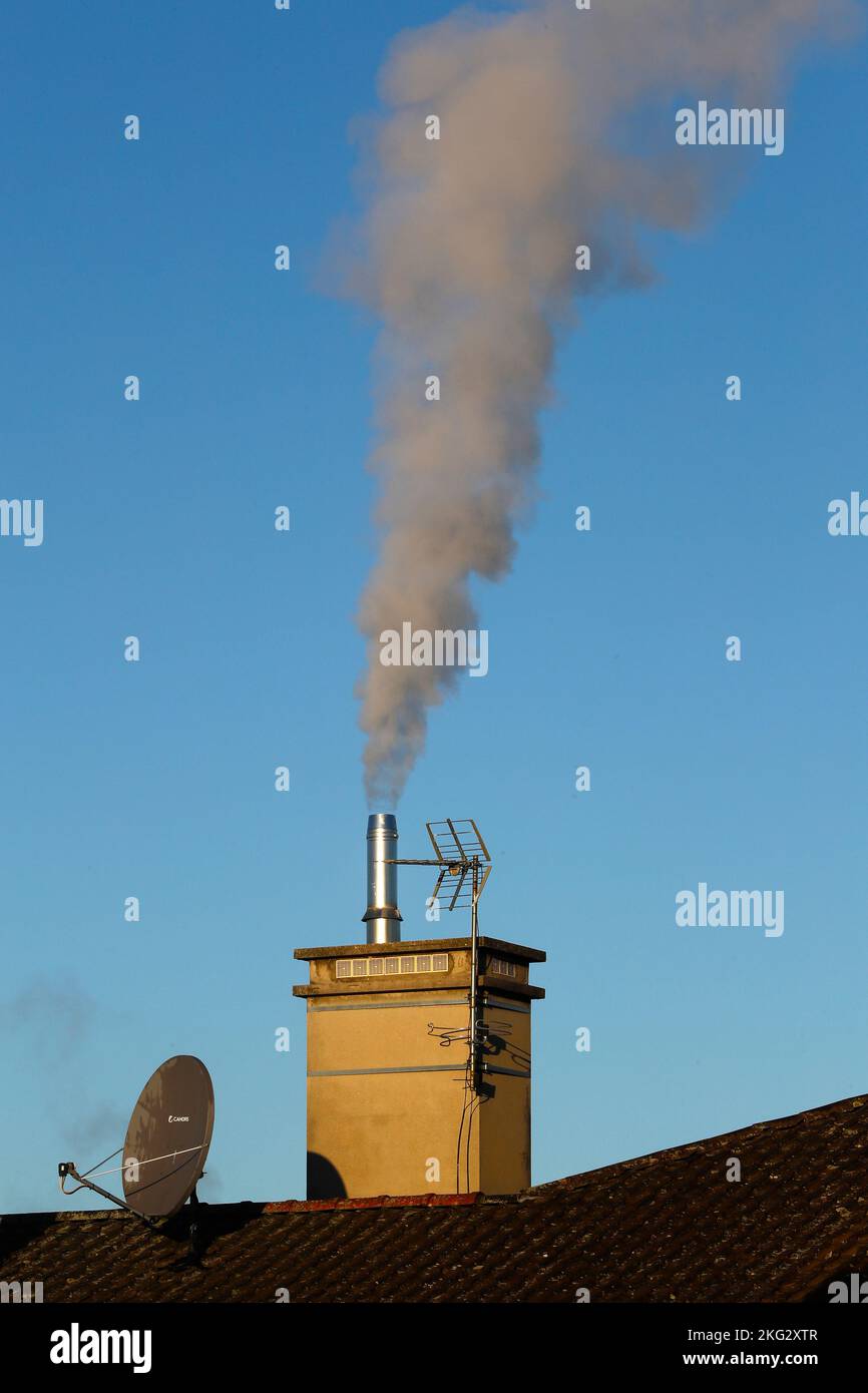 Parabol and smoke coming out of house chimney France Stock Photo - Alamy