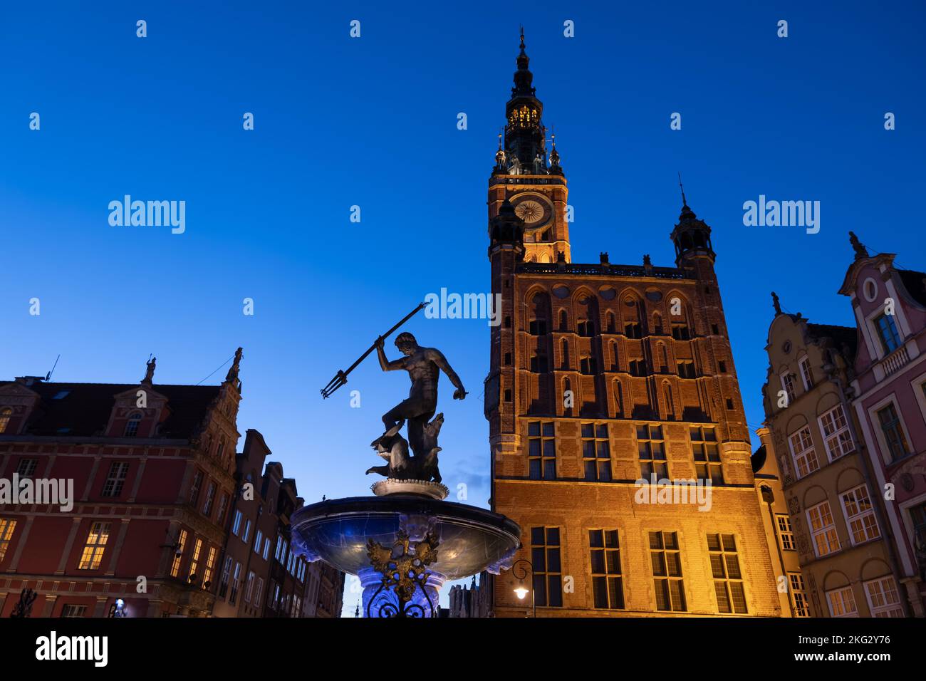 The Neptune Fountain and Main Town Hall building at dusk in city of ...