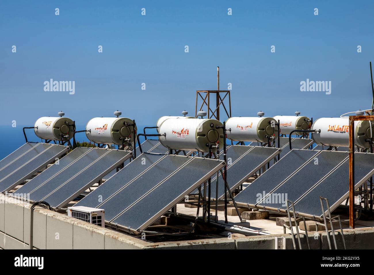 Solar panels and water tanks in Harissa, Lebanon Stock Photo - Alamy
