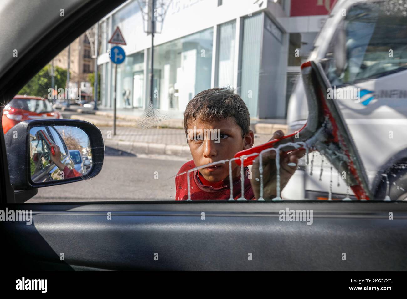 Child cleaning car windows in a street of Saida, Lebanon Stock Photo ...