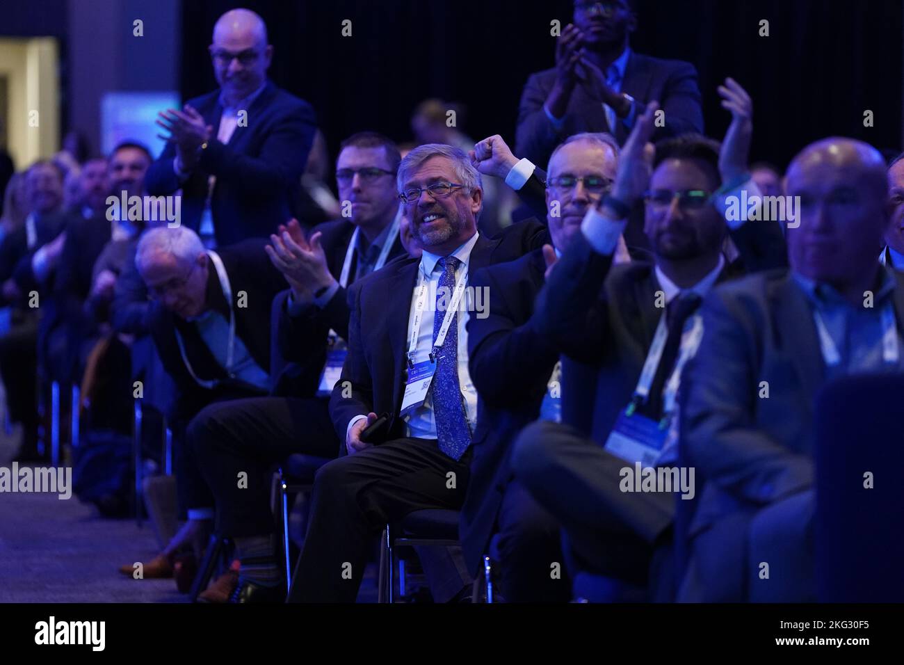Conference attendees watch the England v Iran FIFA World Cup 2022 game ...