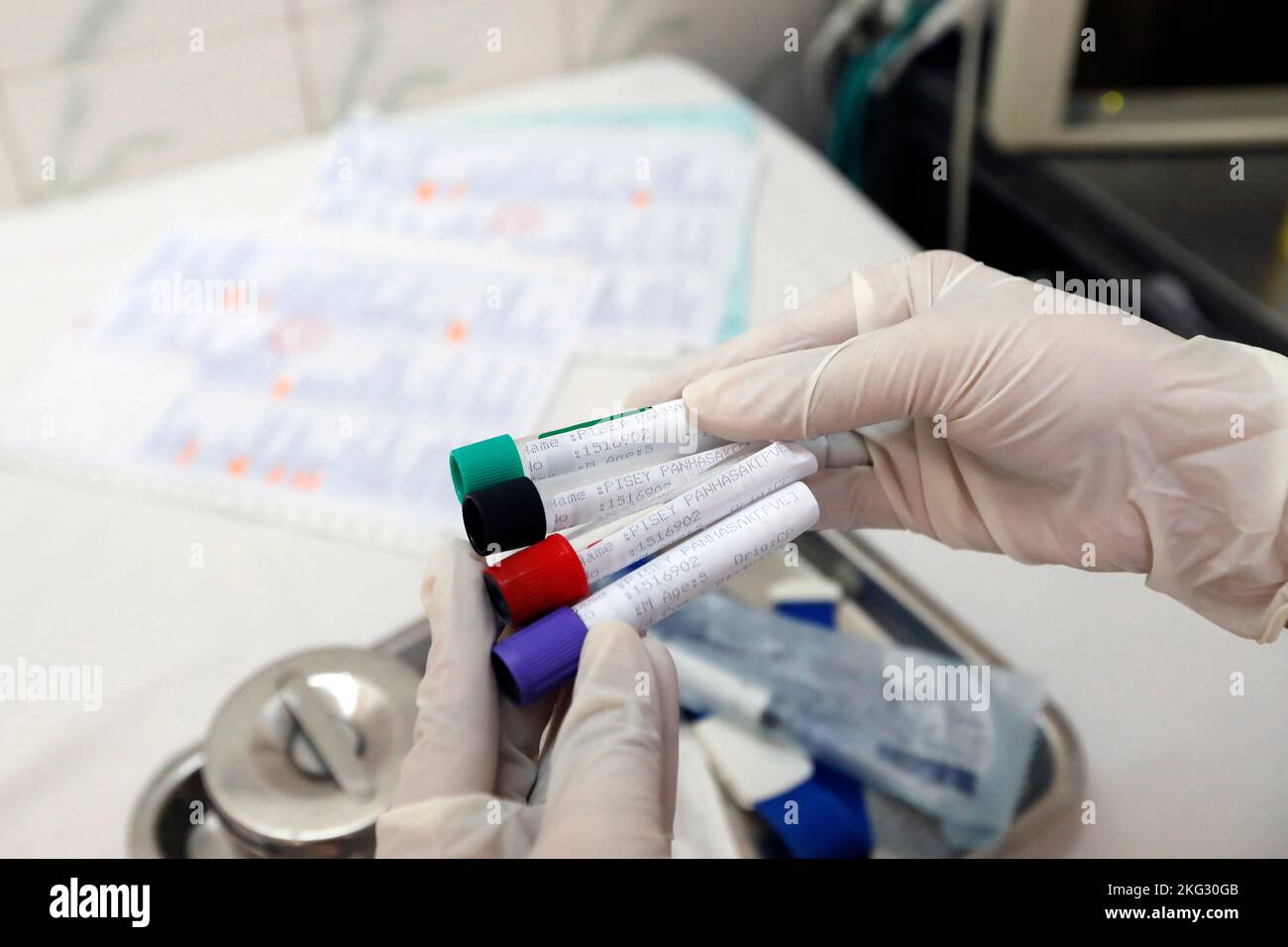 Calmette hospital. Nurse taking blood sample from a young boy. Phnom ...
