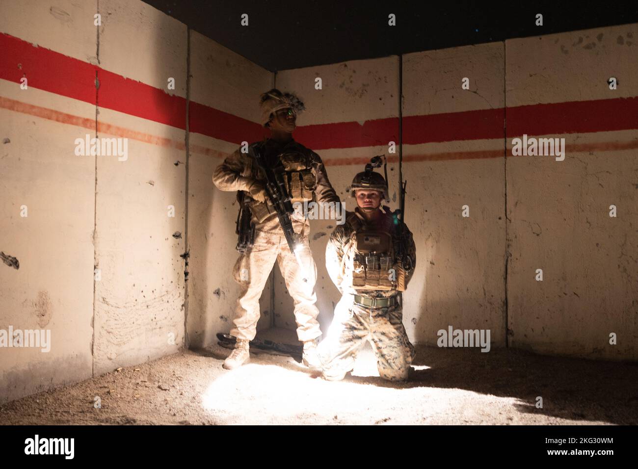 A U.S. Marine Corps infantryman, left, assigned to 2nd Battalion, 7th ...
