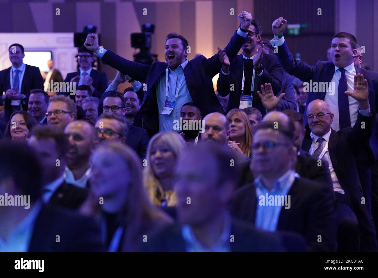 Conference attendees celebrate as they watch the England v Iran FIFA ...