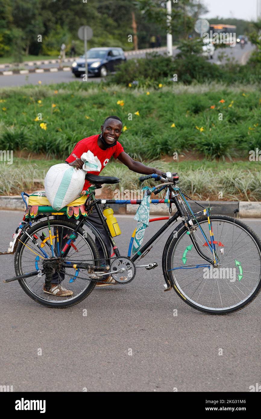 Man pushing a bike in Kigali, Rwanda Stock Photo - Alamy