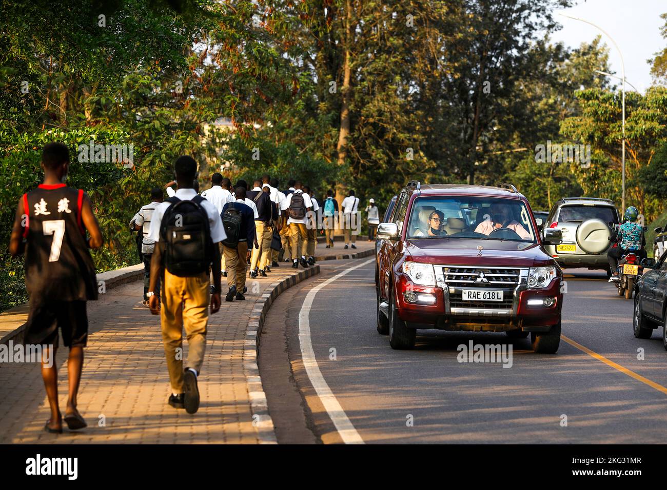 Students walking home from school and traffic in Kigali, Rwanda Stock ...