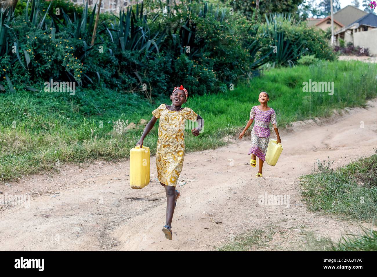 Girls fetching water in Kigali, Rwanda Stock Photo - Alamy