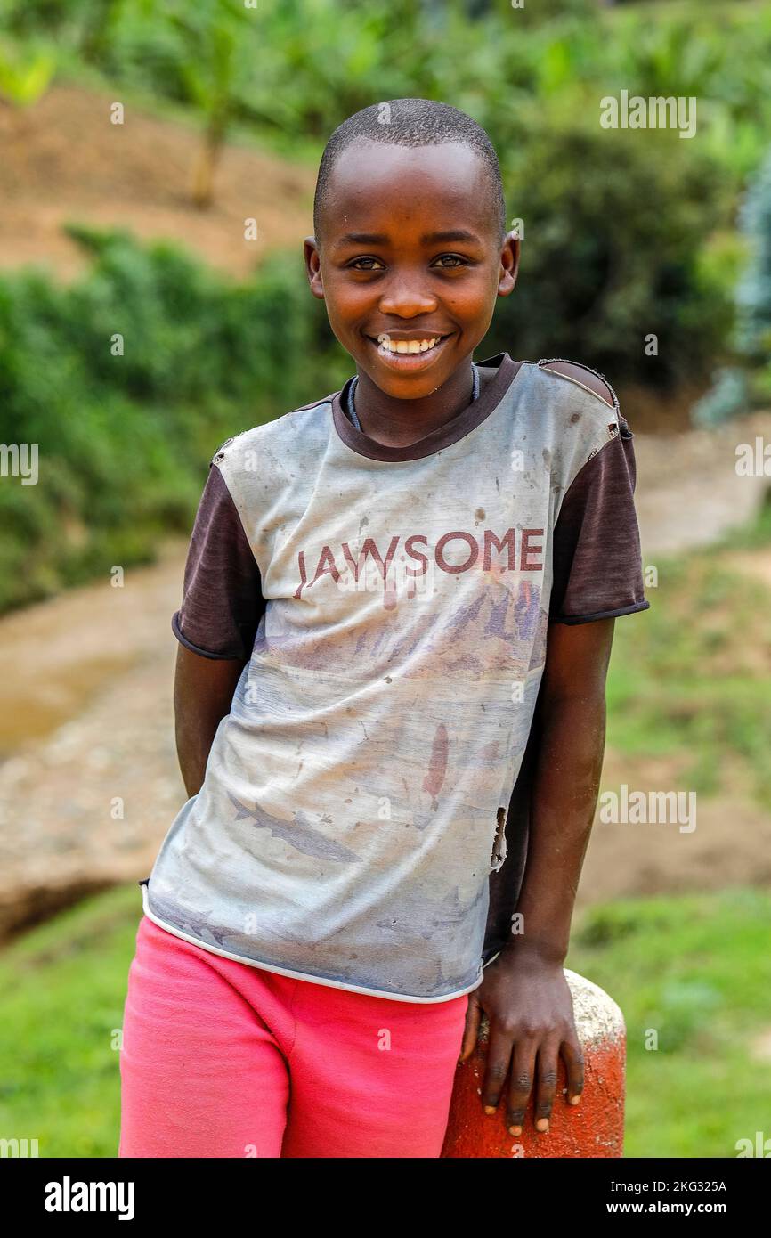Smiling boy standing near a river in western Rwanda Stock Photo - Alamy