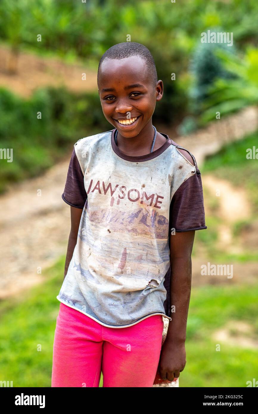 Smiling boy standing near a river in western Rwanda Stock Photo - Alamy