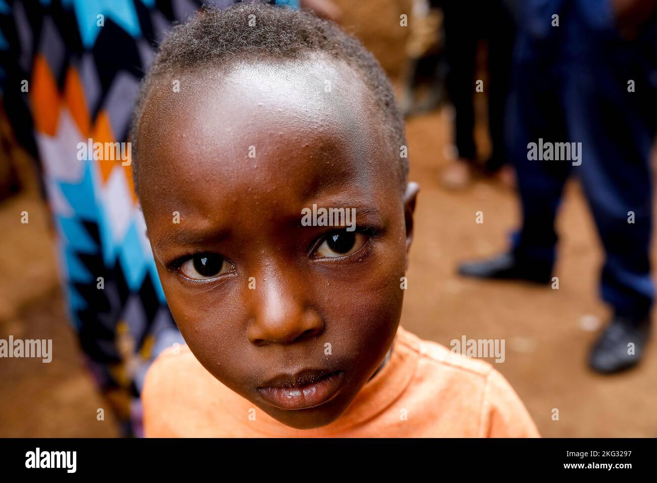 Boy looking at the camera in northern Rwanda Stock Photo - Alamy