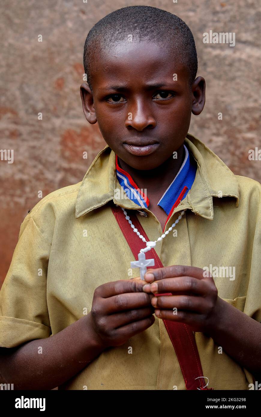 Boy with cross pendant in northern Rwanda Stock Photo - Alamy