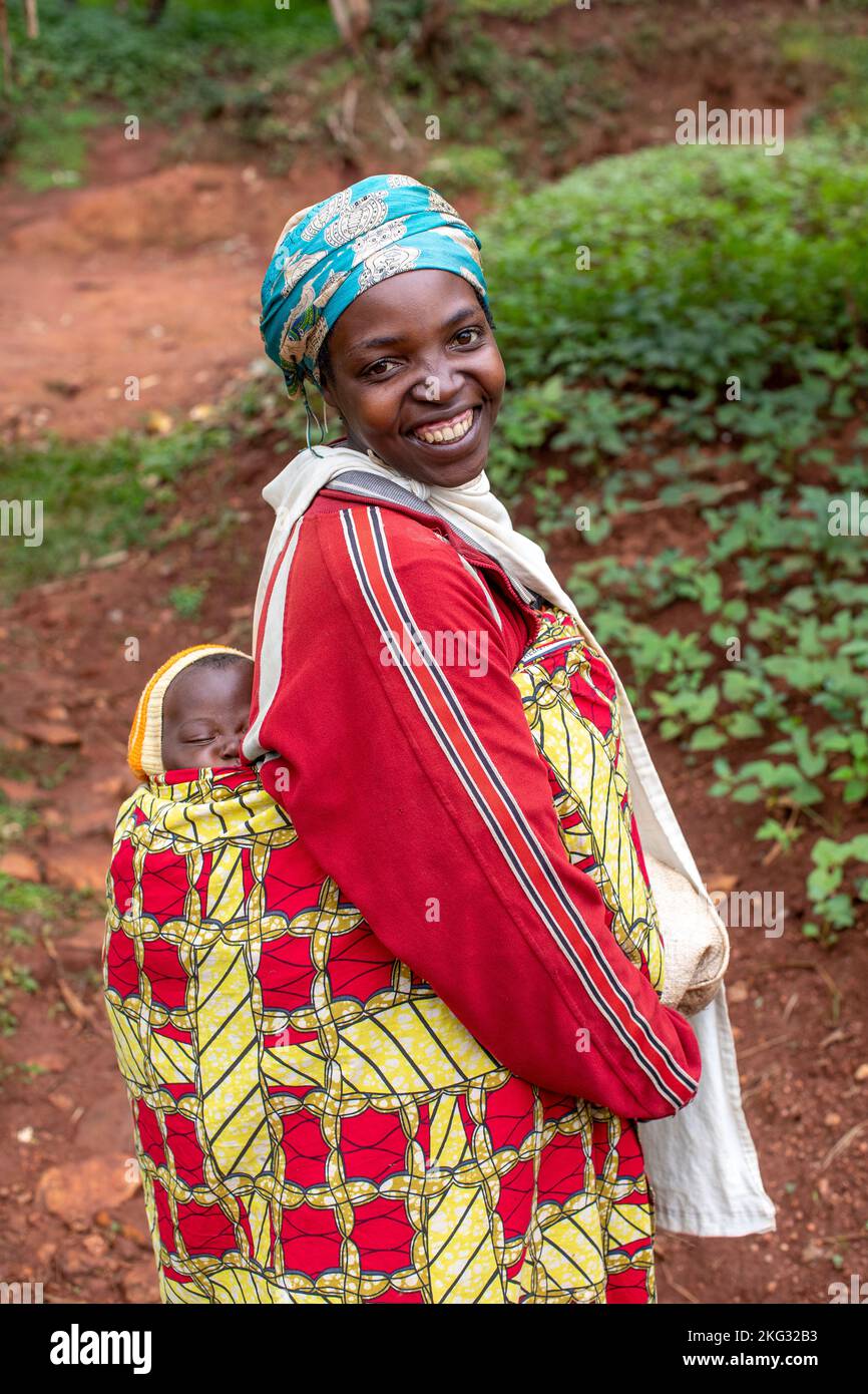 Mother carrying her baby on her back in southern Rwanda Stock Photo - Alamy