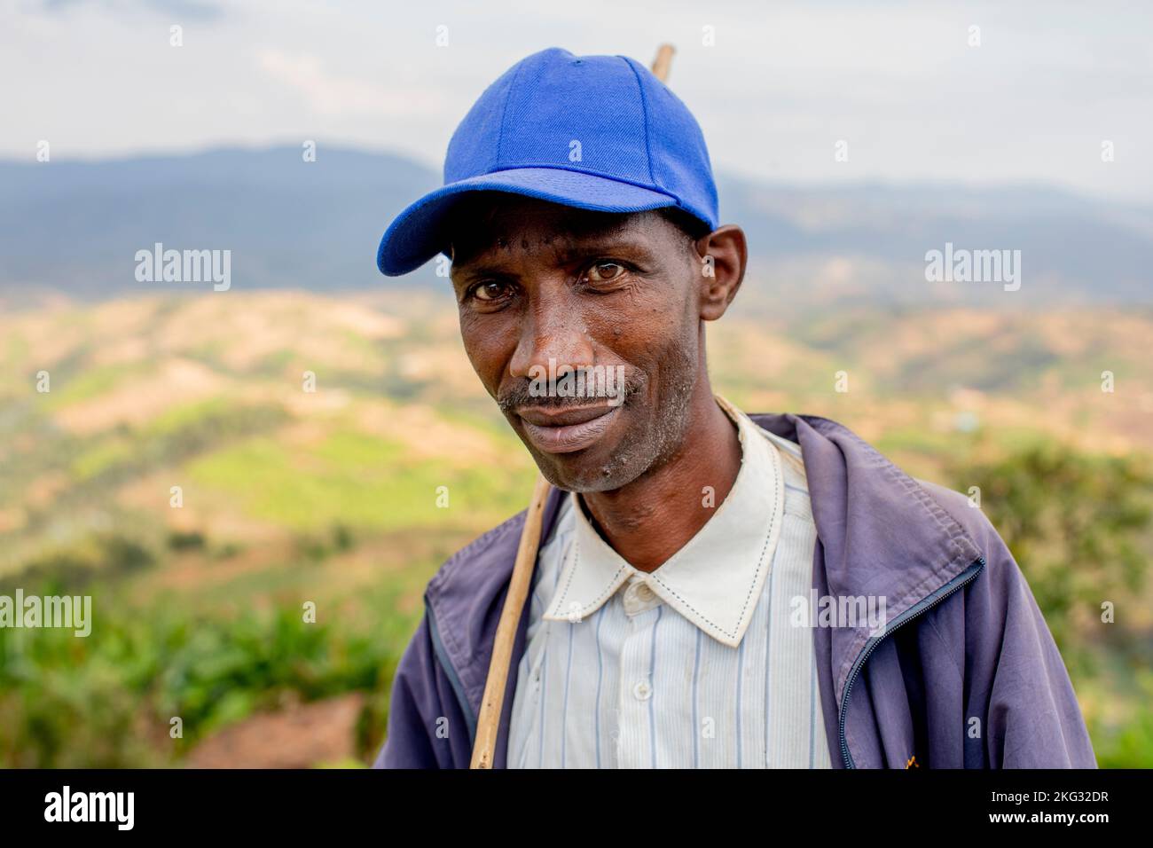 Man standing on a roadside in western Rwanda Stock Photo - Alamy