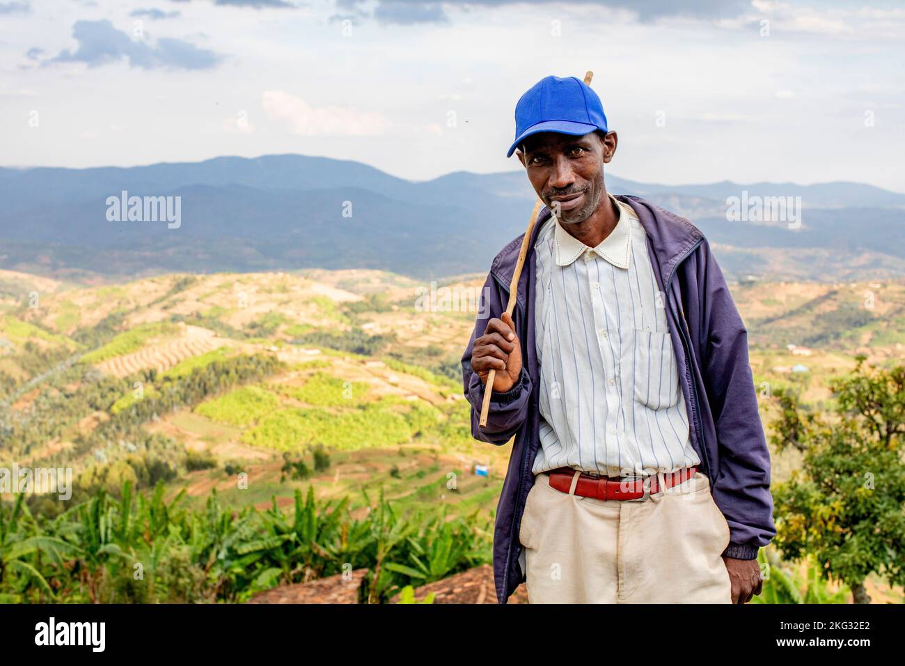 Man standing on a roadside in western Rwanda Stock Photo - Alamy