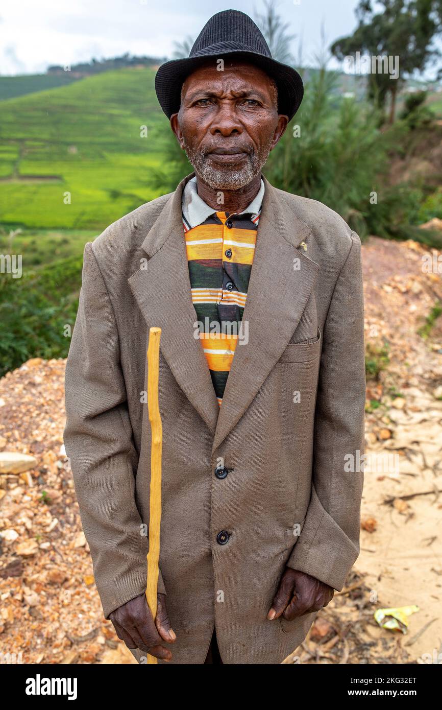 Elderly man standing in western Rwanda Stock Photo - Alamy